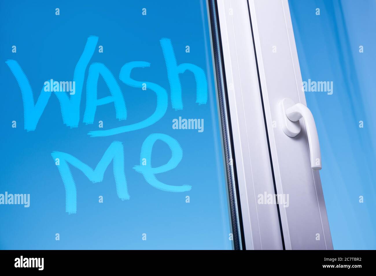 cleaning concept - wash me words on dirty window Stock Photo - Alamy