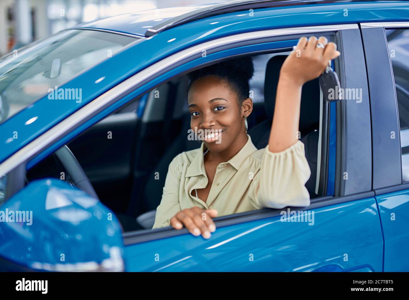 young attractive afro woman enjoy being owner of new auto, business ...