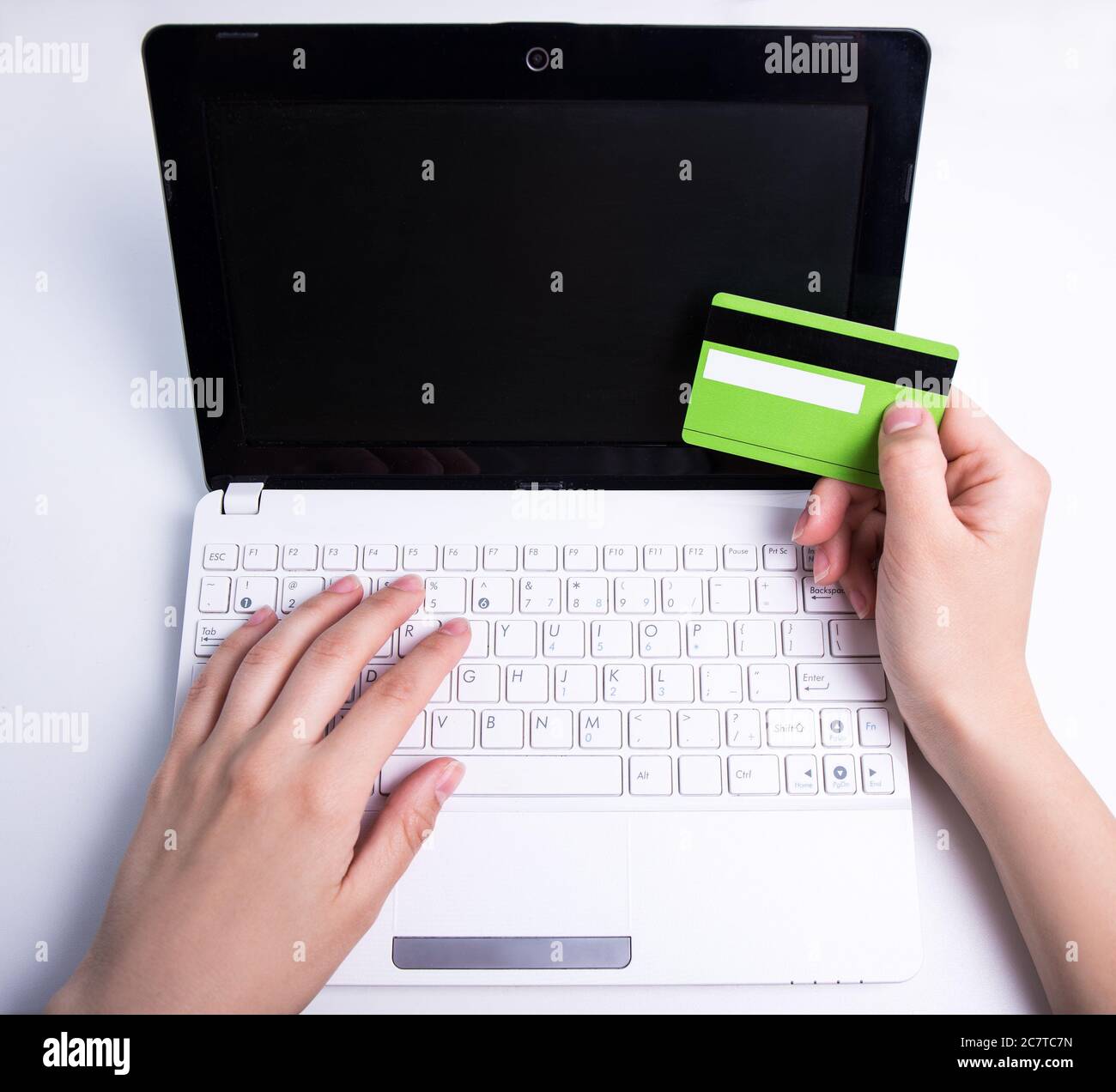 online shopping - laptop with blank screen and female hands holding ...