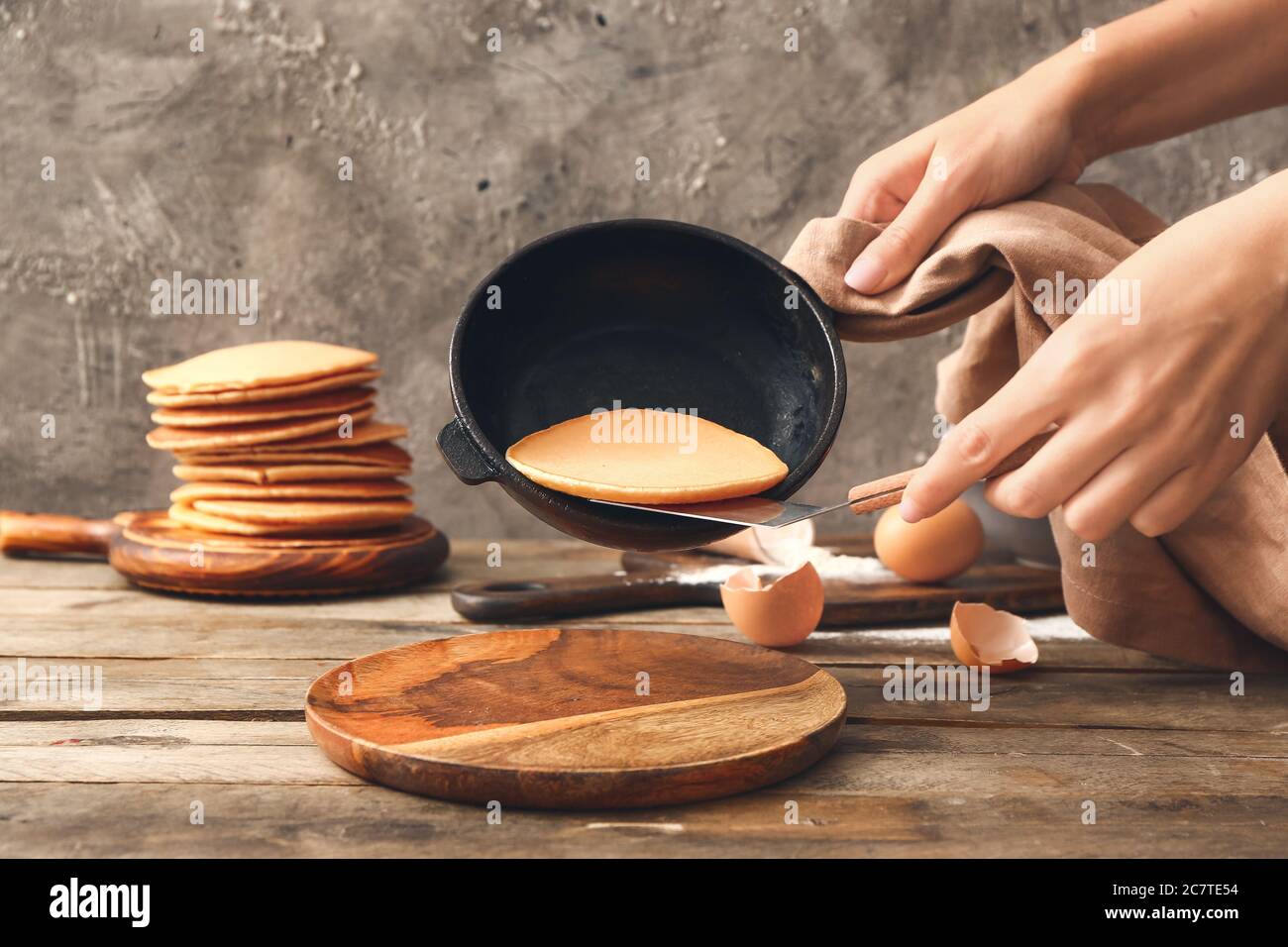 Woman preparing homemade pancakes in hi-res stock photography and ...
