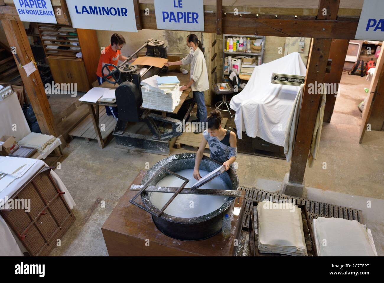 PROVENCE, FRANCE - JUL 8, 2014: Workers made a paper in medieval paper ...