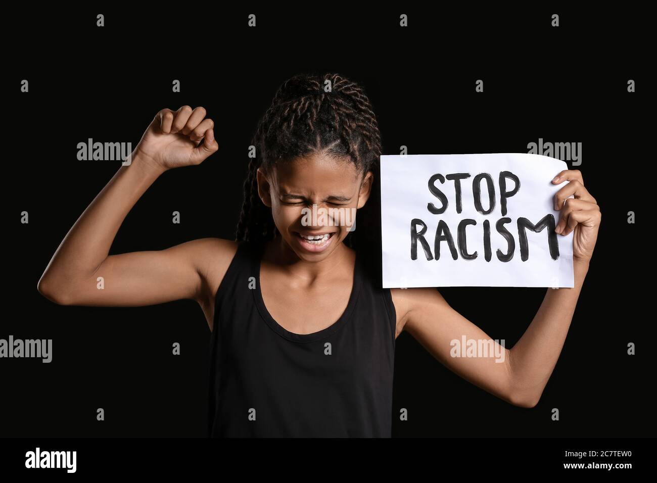 Stressed African-American girl with poster on dark background. Stop ...