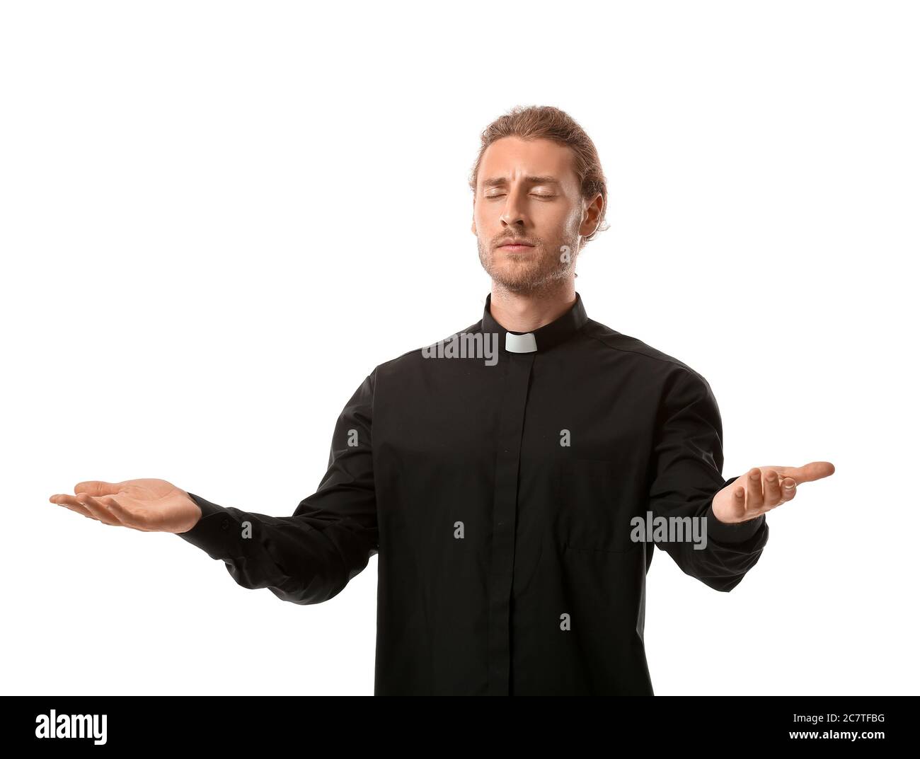 Praying priest on white background Stock Photo - Alamy