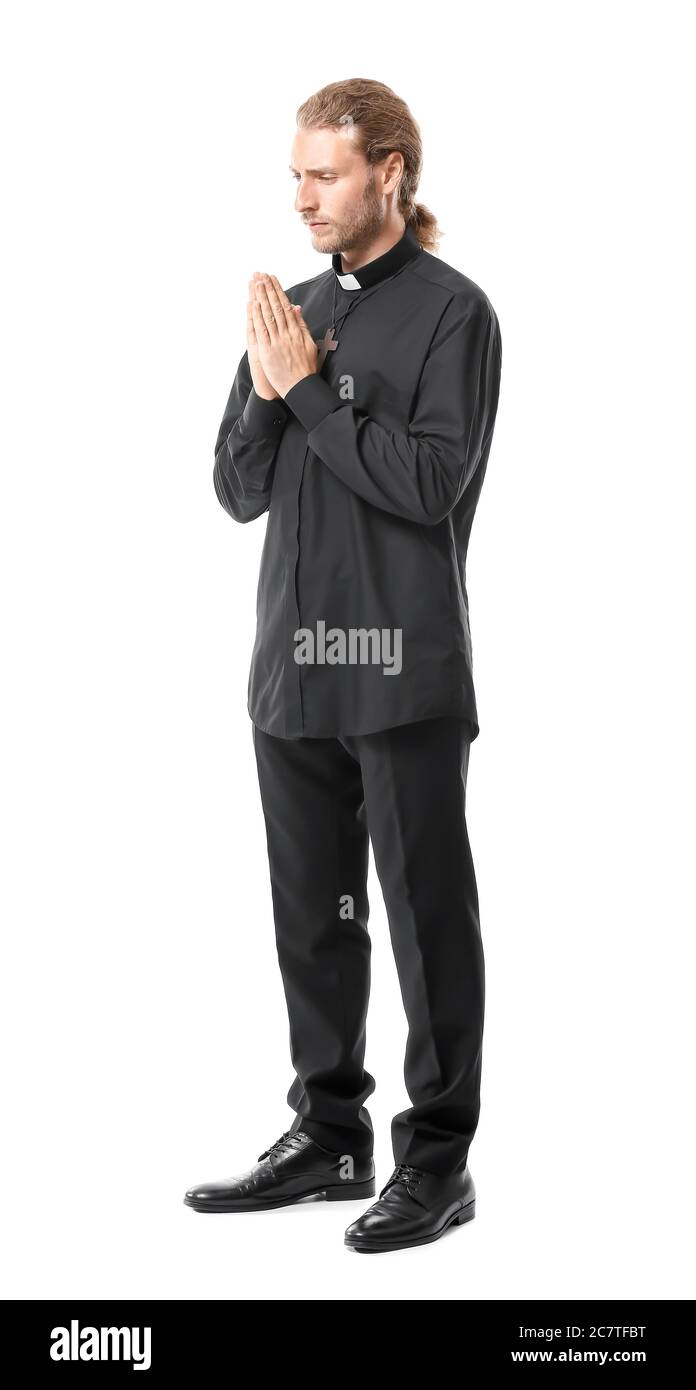 Praying priest on white background Stock Photo - Alamy
