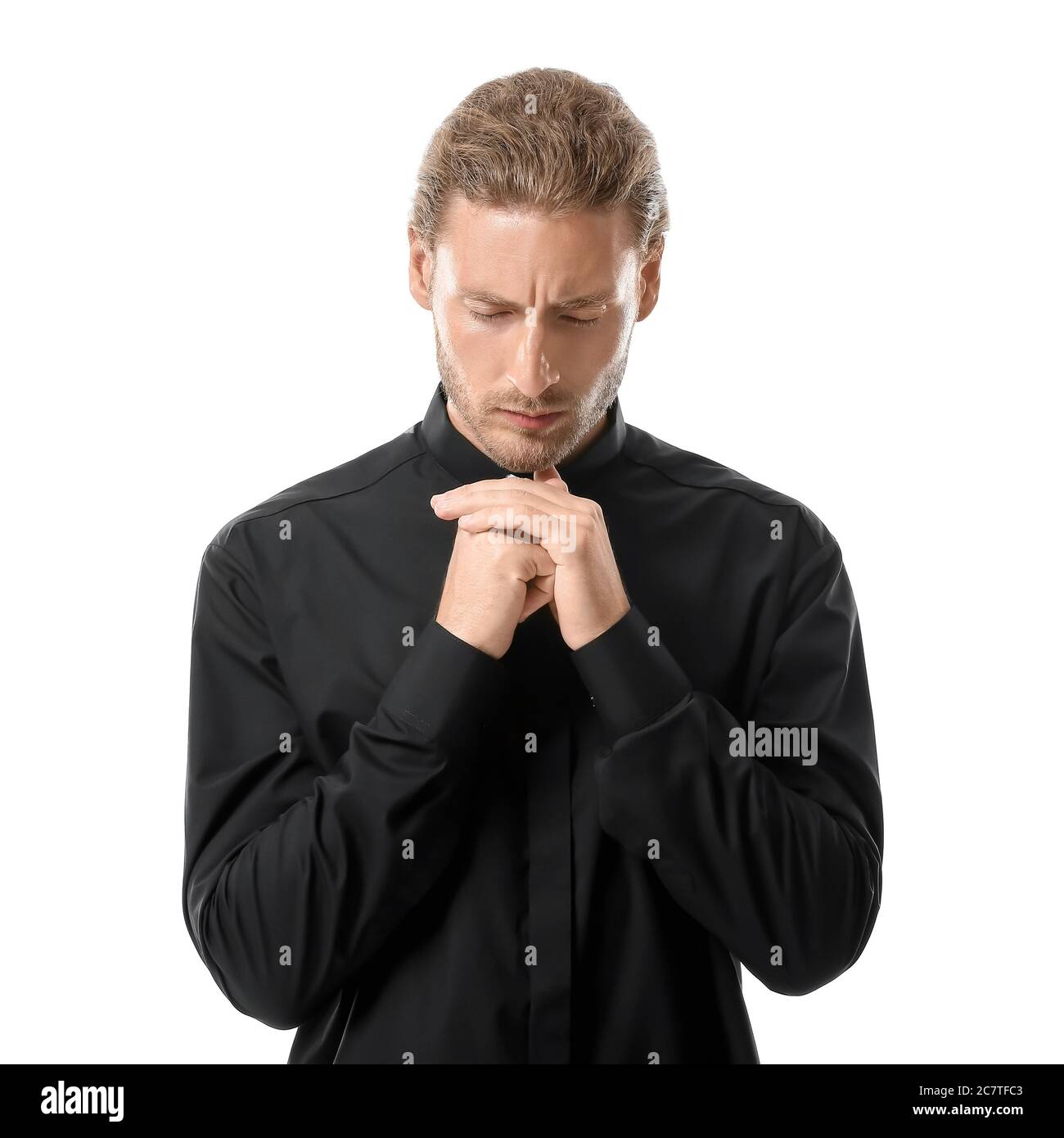 Praying priest on white background Stock Photo - Alamy