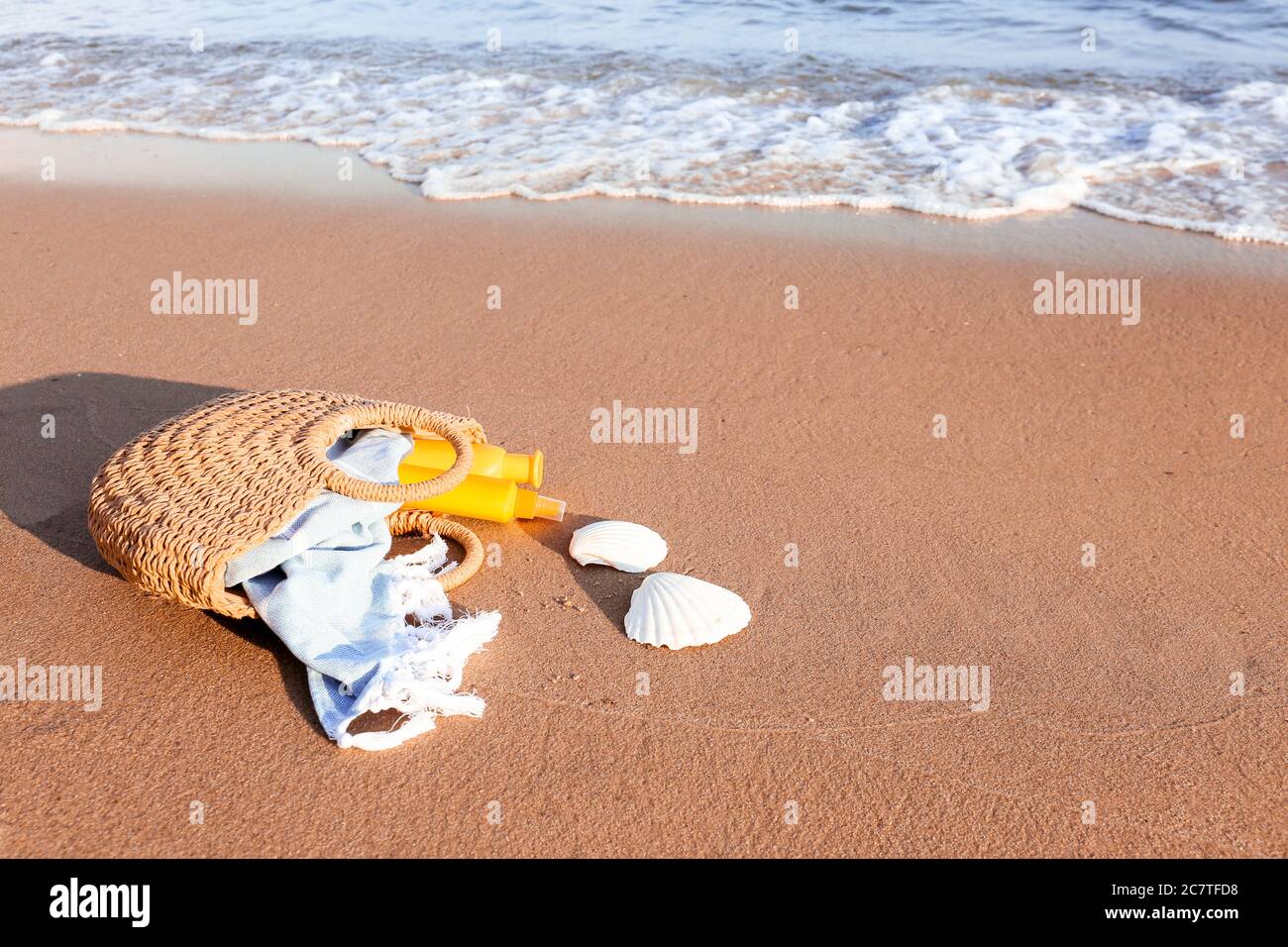 Bag with sunscreen cream on beach Stock Photo - Alamy