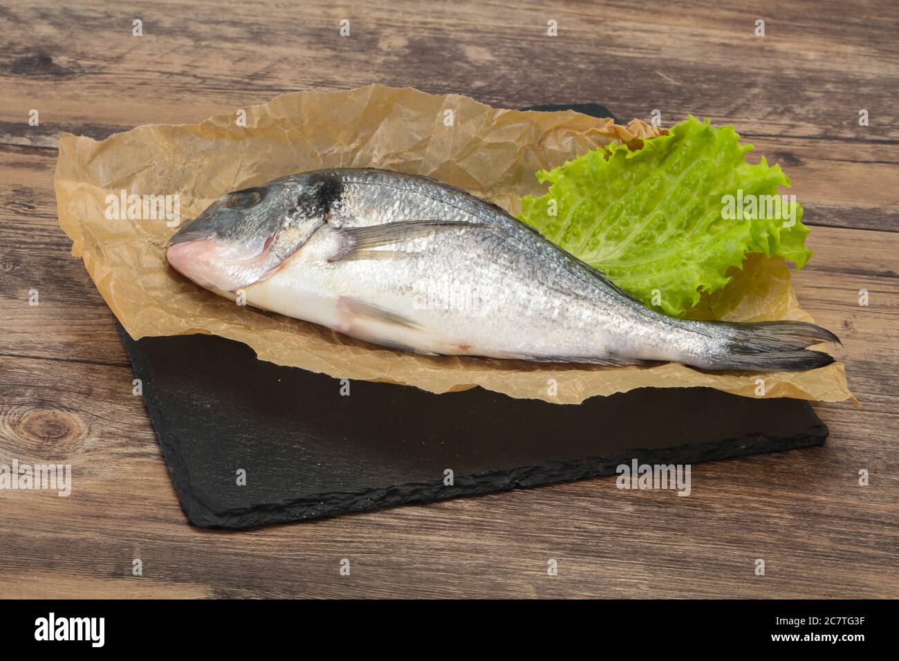 Raw Dorada fish ready for cooking Stock Photo - Alamy