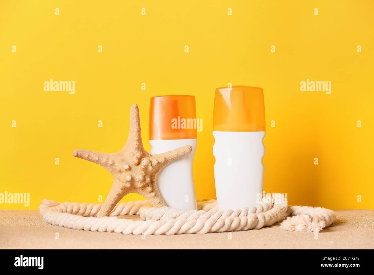 Bottles of sunscreen on color background Stock Photo - Alamy