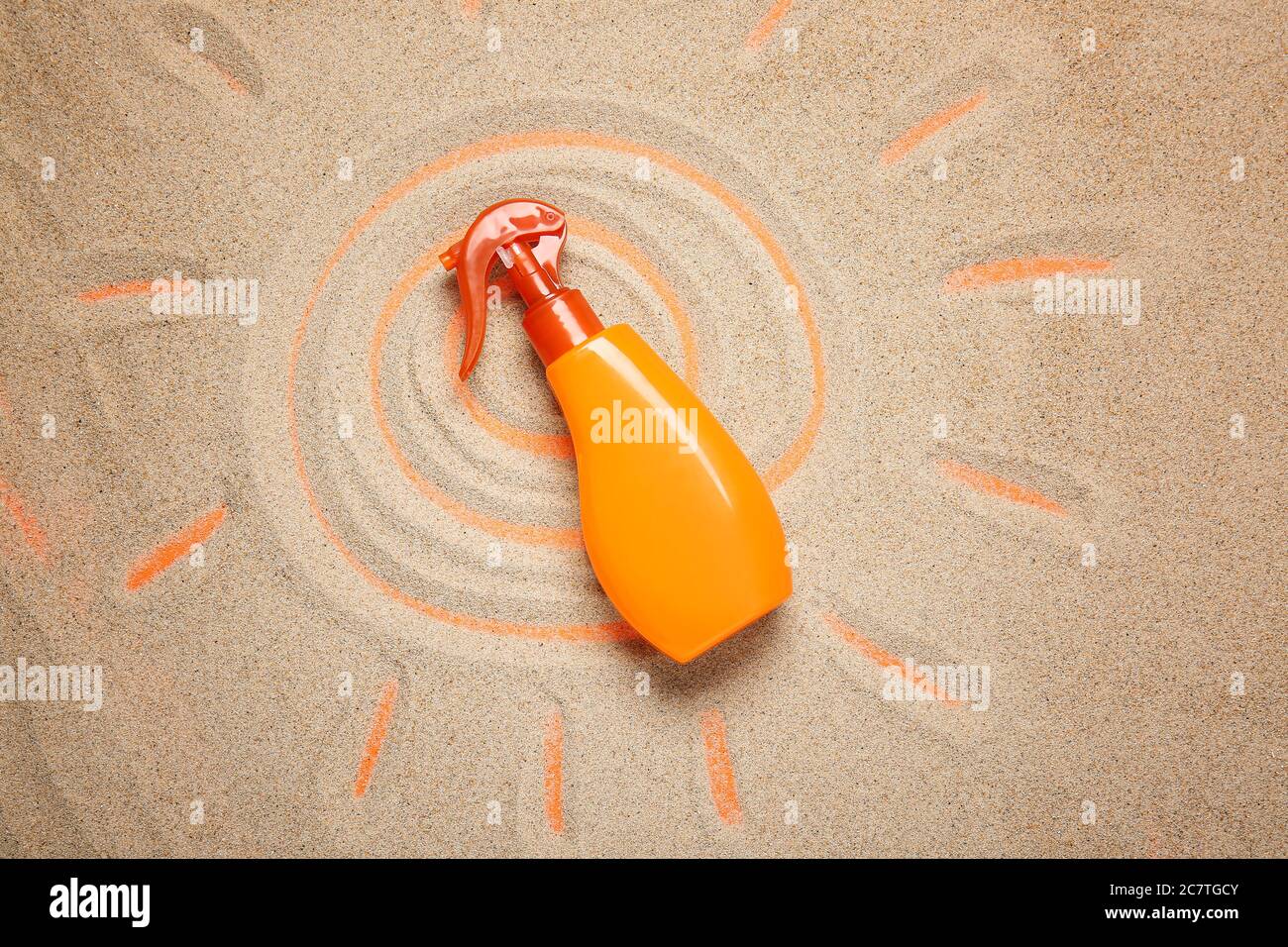 Composition with sunscreen cream on sand Stock Photo - Alamy
