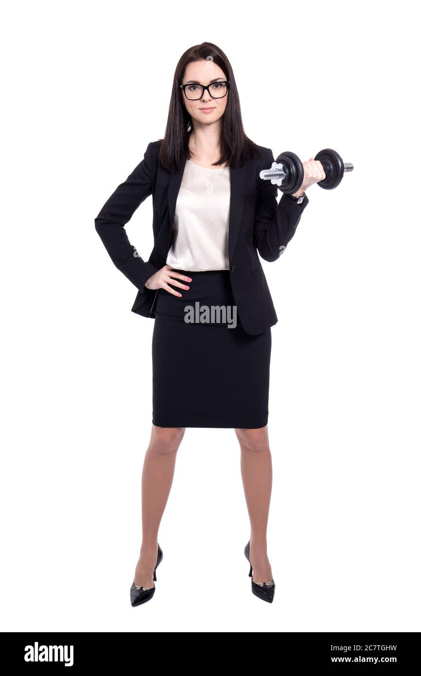 hard work concept - young beautiful business woman with dumbbell ...