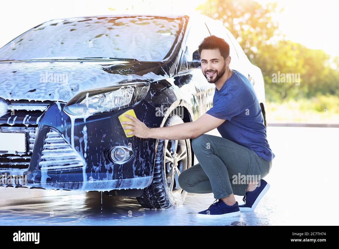 Man washing his car outdoors Stock Photo - Alamy