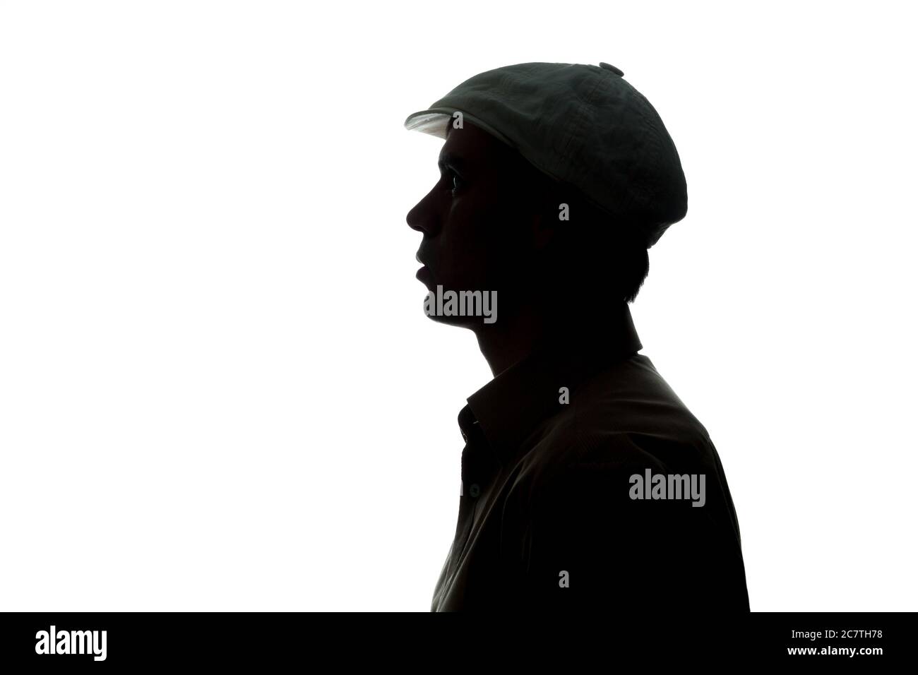 Portrait of a young man in cap, side view - silhouette Stock Photo - Alamy