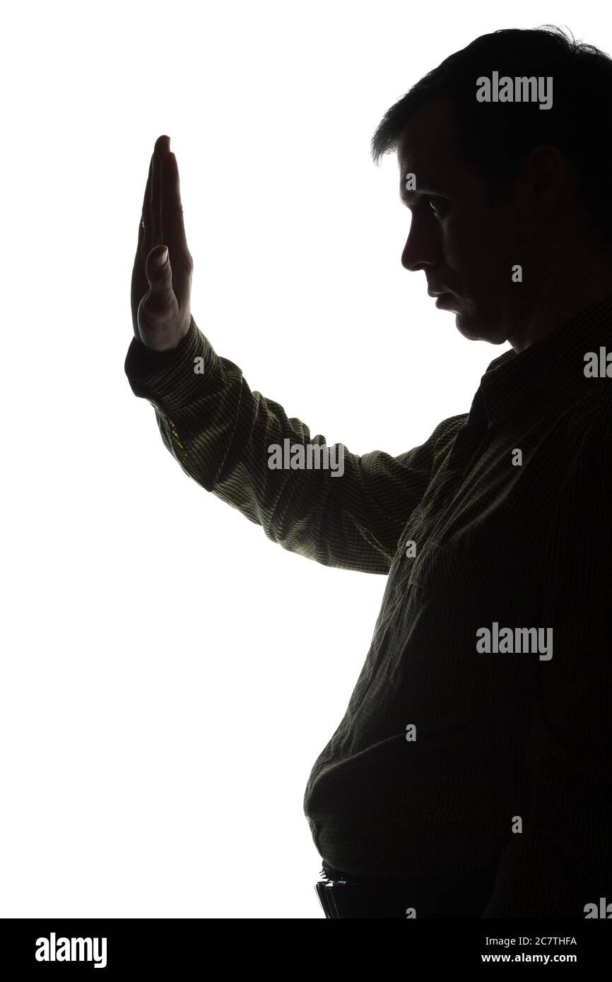 Silhouette man hands raised hi-res stock photography and images - Alamy