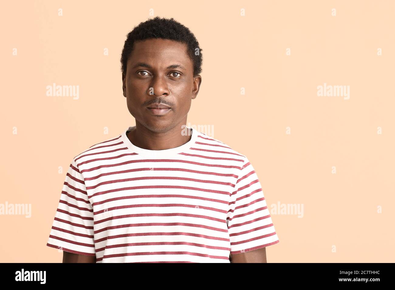 Sad African-American man on color background. Stop racism Stock Photo ...