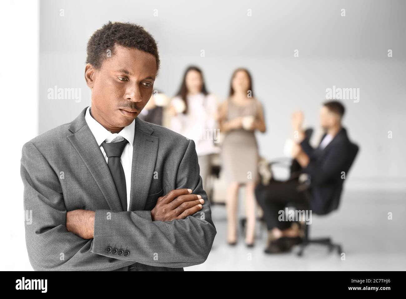 Lonely African-American businessman in office. Stop racism Stock Photo ...