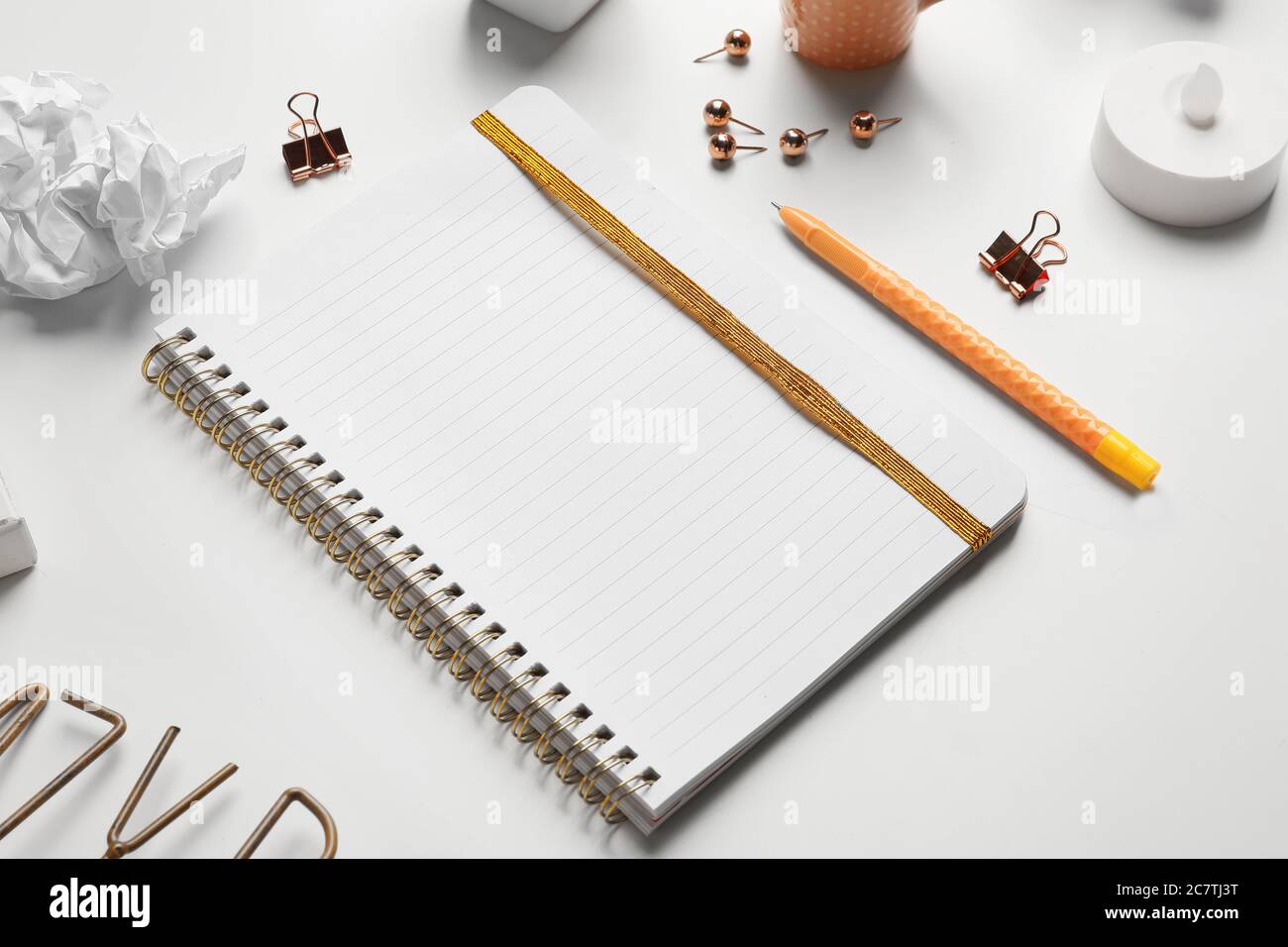 Notebook on stationery on white background Stock Photo - Alamy