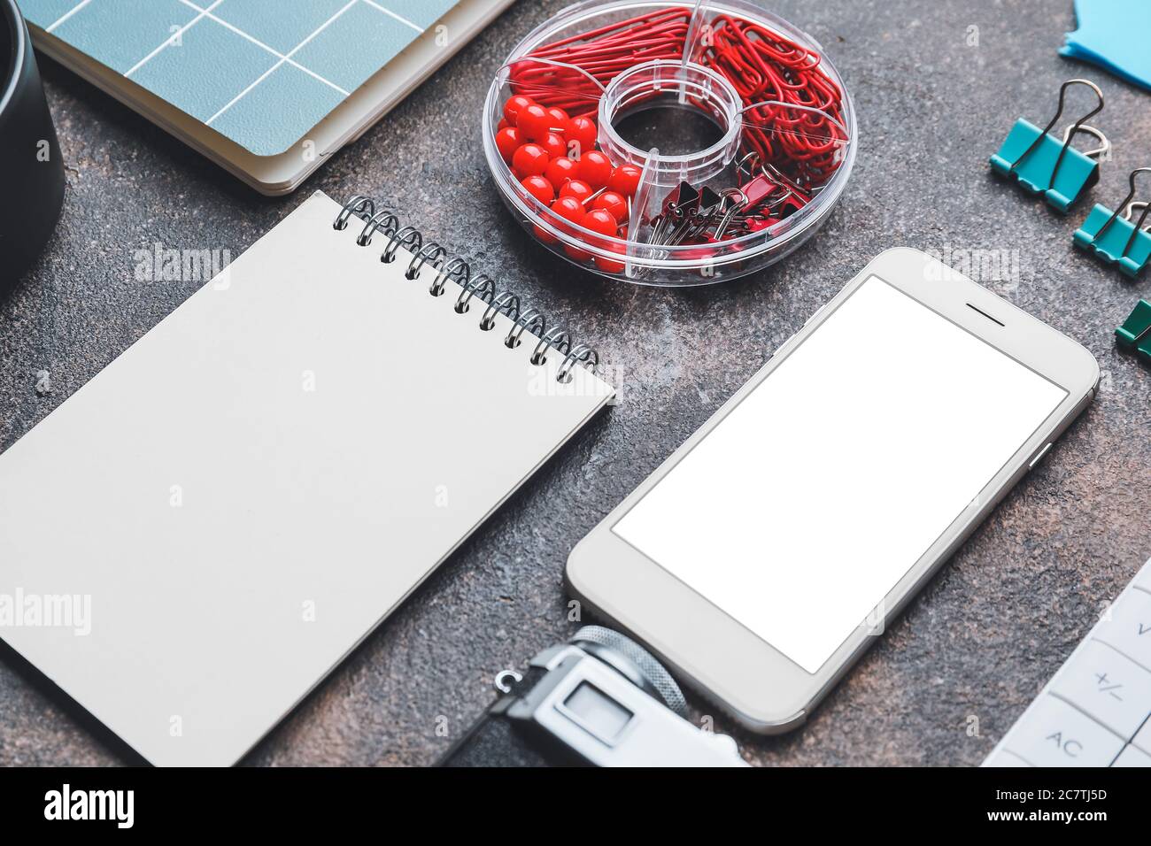 Notebooks with mobile phone on dark Stock Photo - Alamy