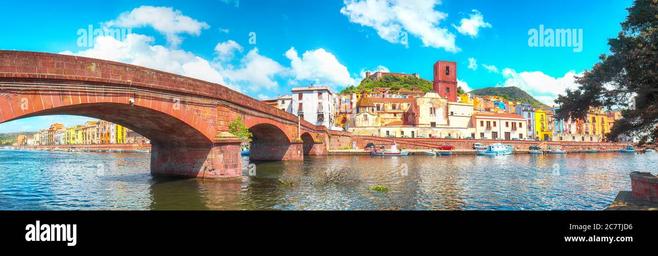 Astonishing cityscape of Bosa town with Ponte Vecchio bridge across the ...