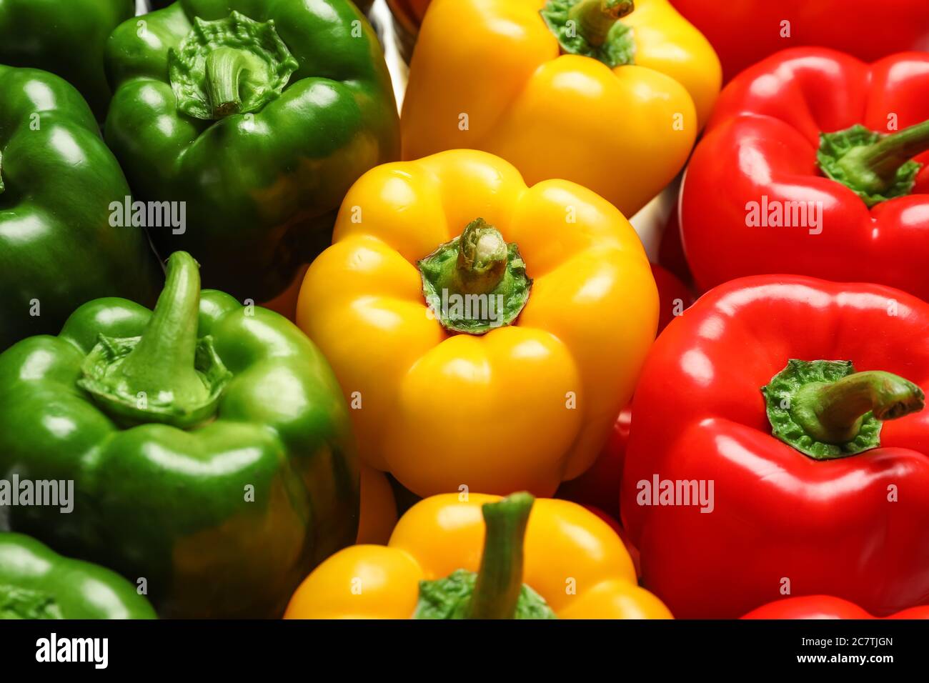 Different bell pepper as background Stock Photo - Alamy