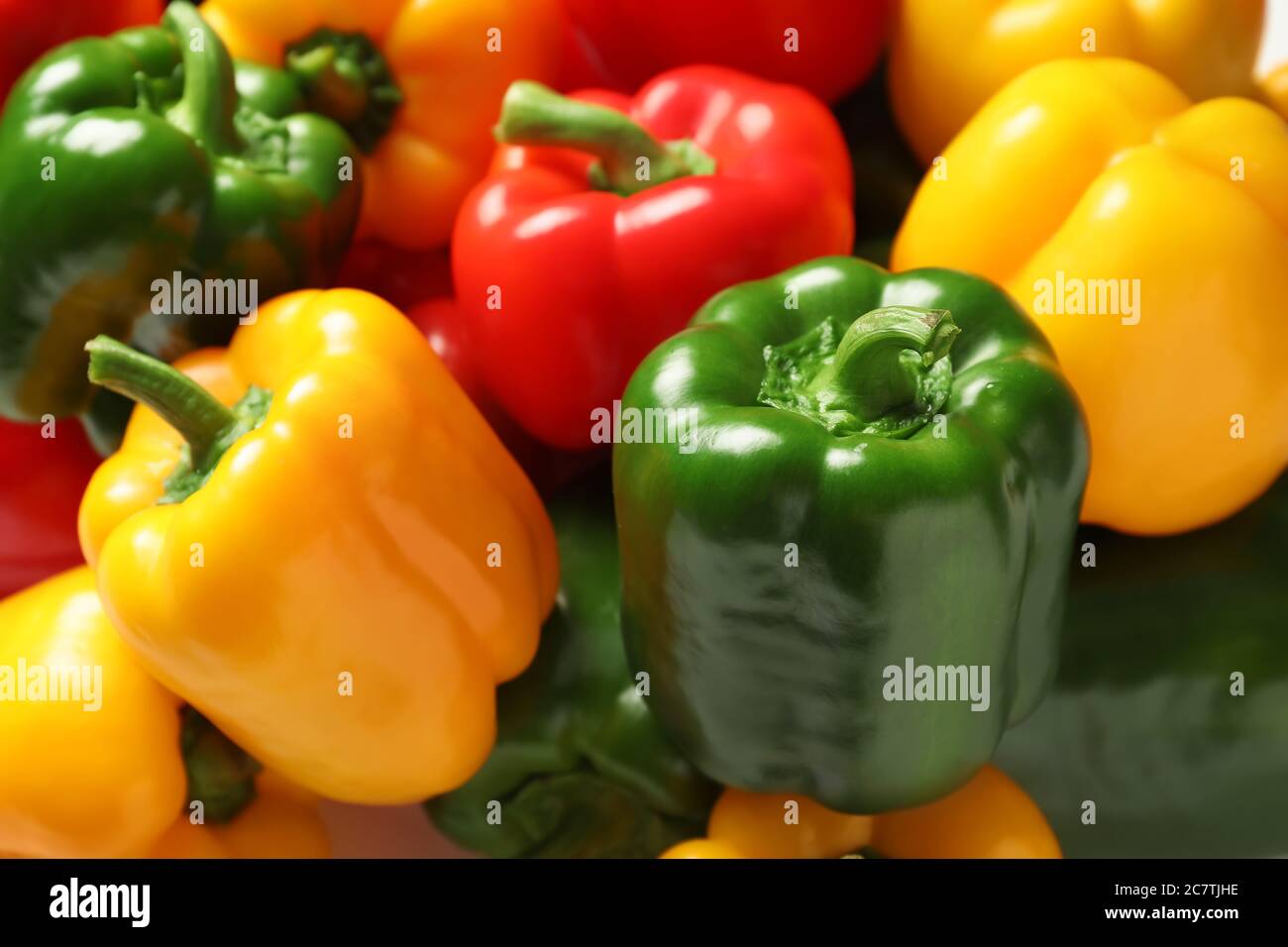 Different bell pepper as background Stock Photo - Alamy