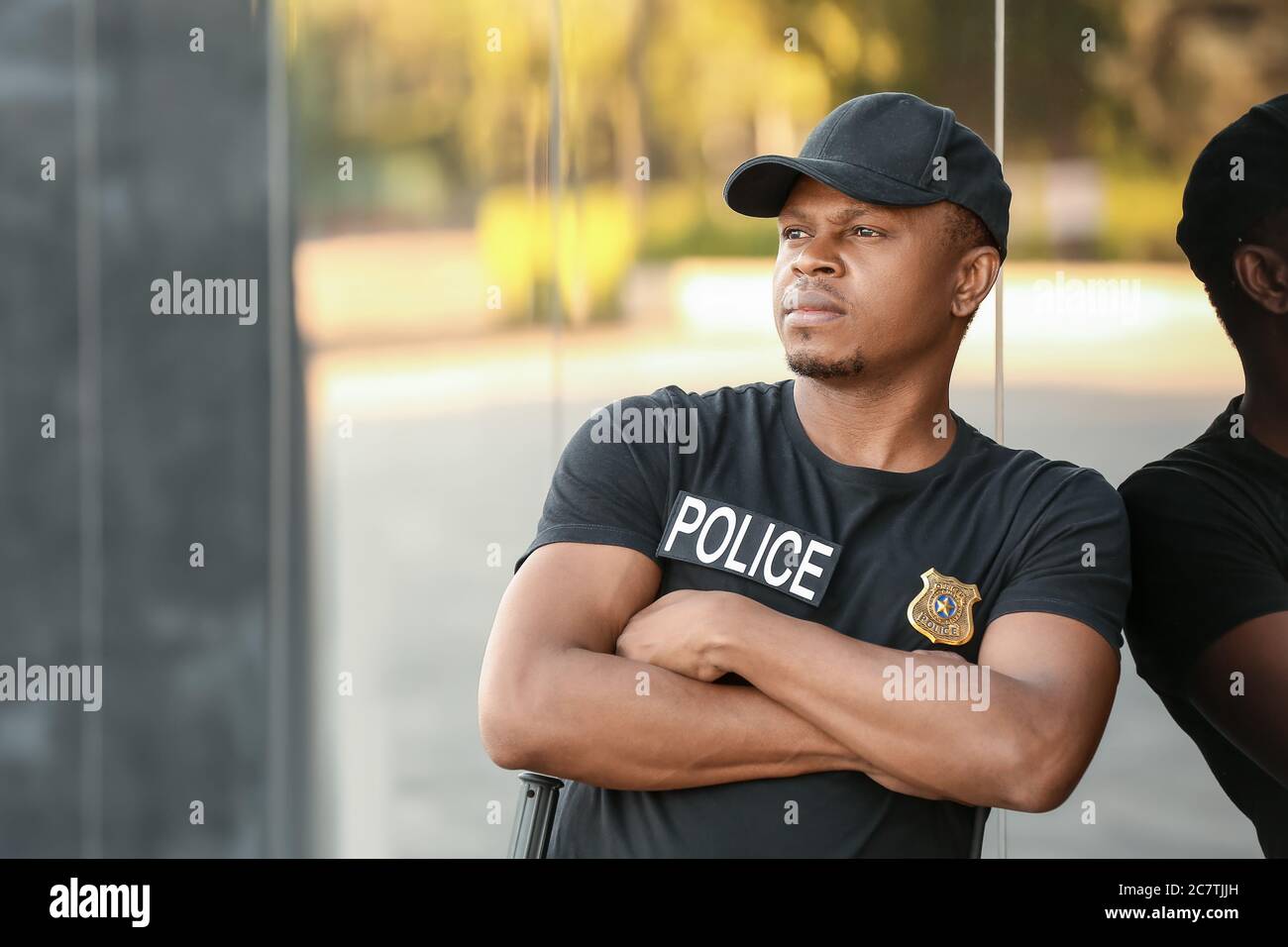 African-American police officer in the street Stock Photo - Alamy