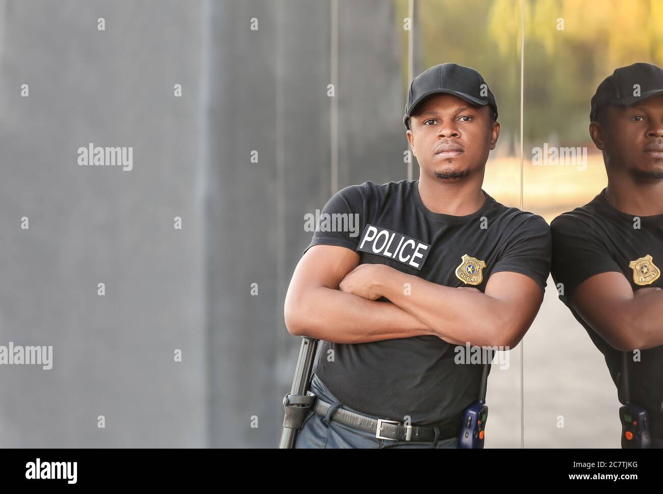 African-American police officer in the street Stock Photo - Alamy