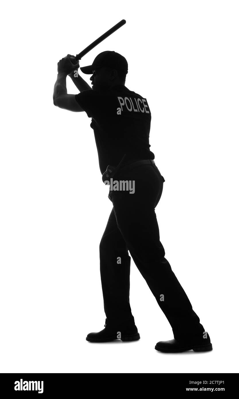 Silhouette of aggressive African-American police officer with baton on ...