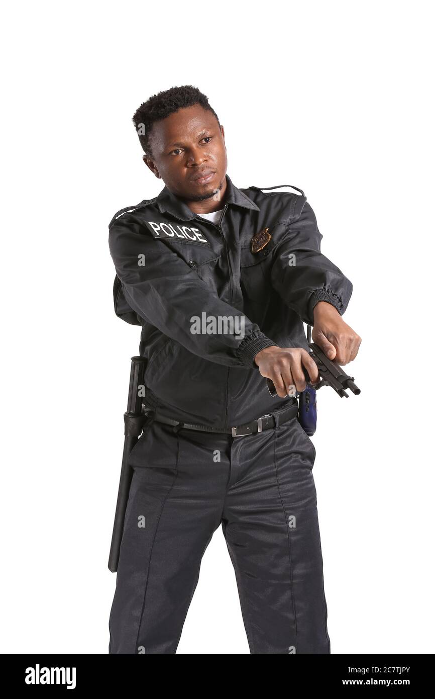 Aggressive African-American police officer with gun on white background ...