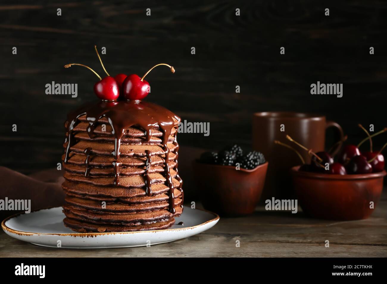 Plate with delicious chocolate pancakes on table Stock Photo - Alamy