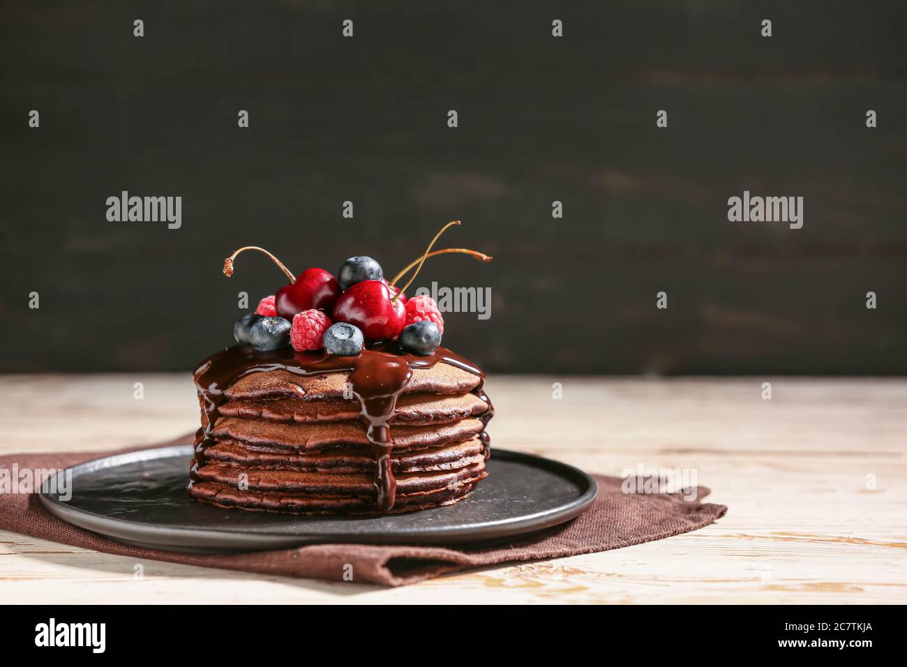 Plate with delicious chocolate pancakes on table Stock Photo - Alamy