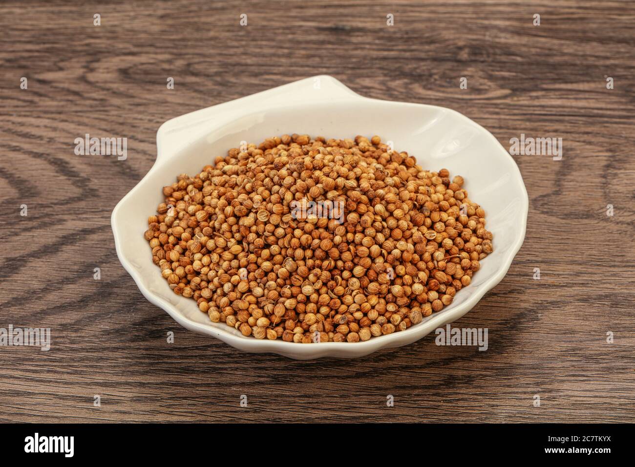 Dry Coriander seeds in the bowl Stock Photo - Alamy