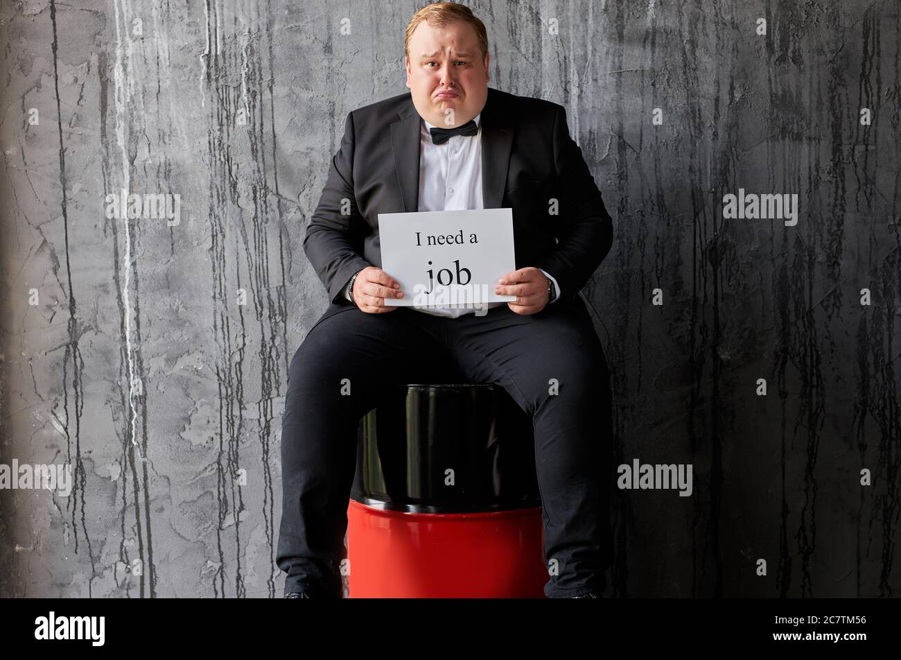 ruined caucasian oilman lost his job, fat guy in formal wear looking ...