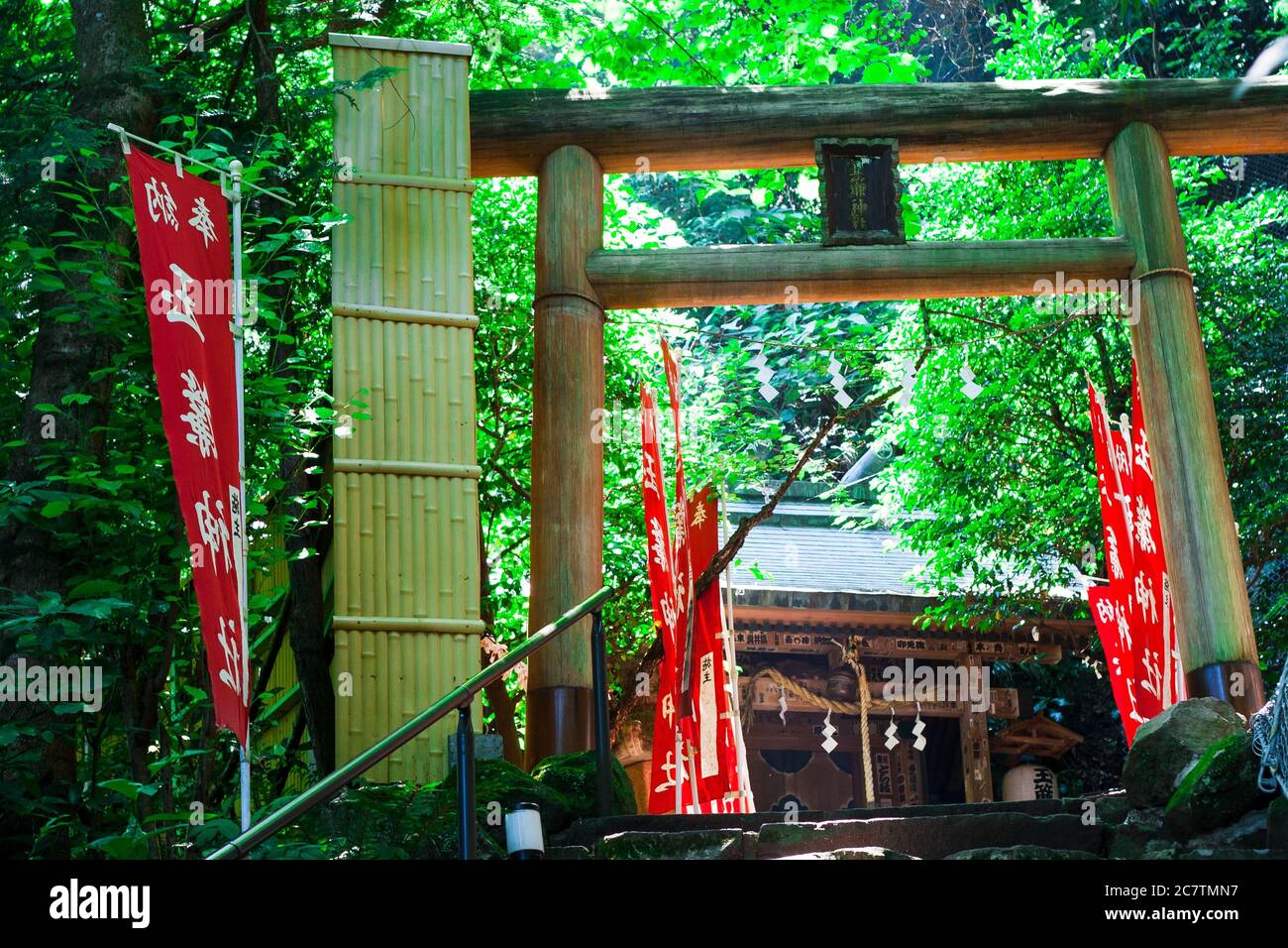Japanese torii gate on the background of a temple Stock Photo - Alamy