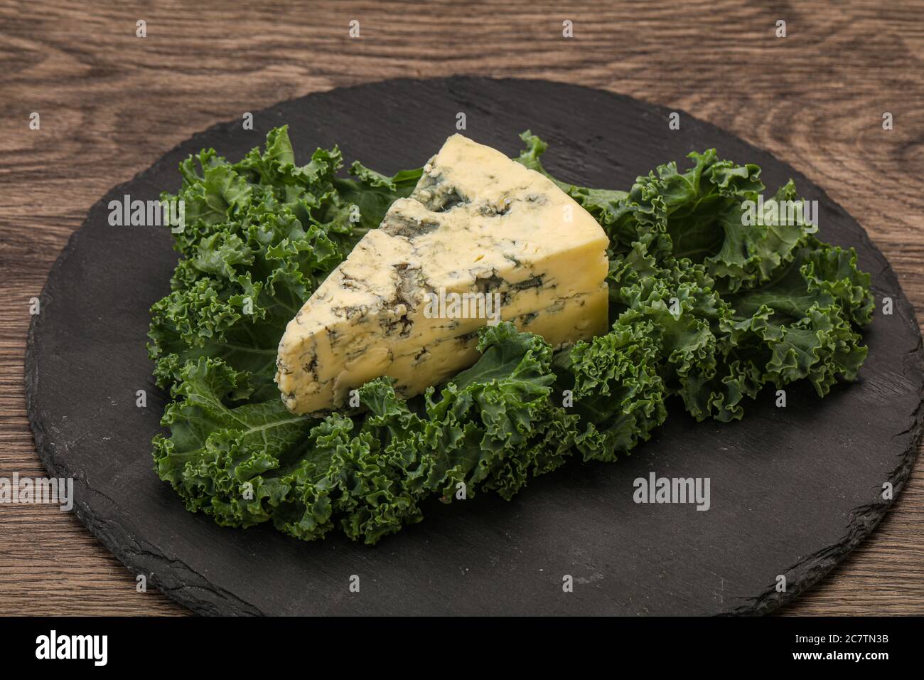 Dairy Blue cheese triangle with mold Stock Photo - Alamy