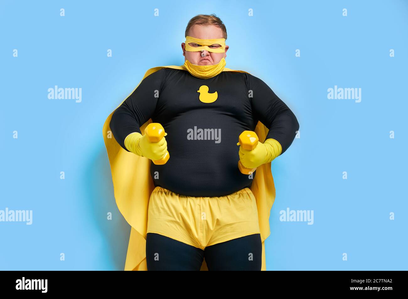 strong fat caucasian superhero shows muscles at camera, emotional man ...