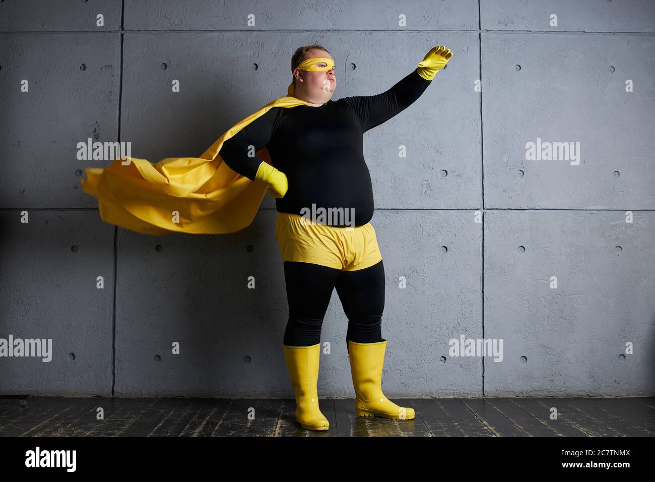 fat superhero caucasian man is able to save the world, he is wearing ...