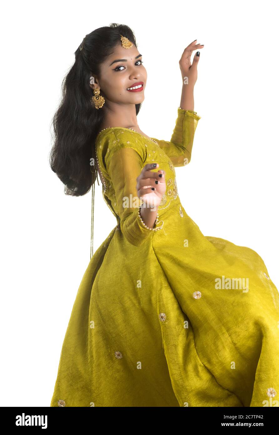 Portrait of beautiful traditional Indian girl posing on white ...