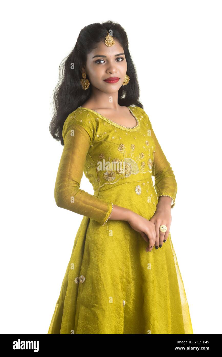 Portrait of beautiful traditional Indian girl posing on white ...
