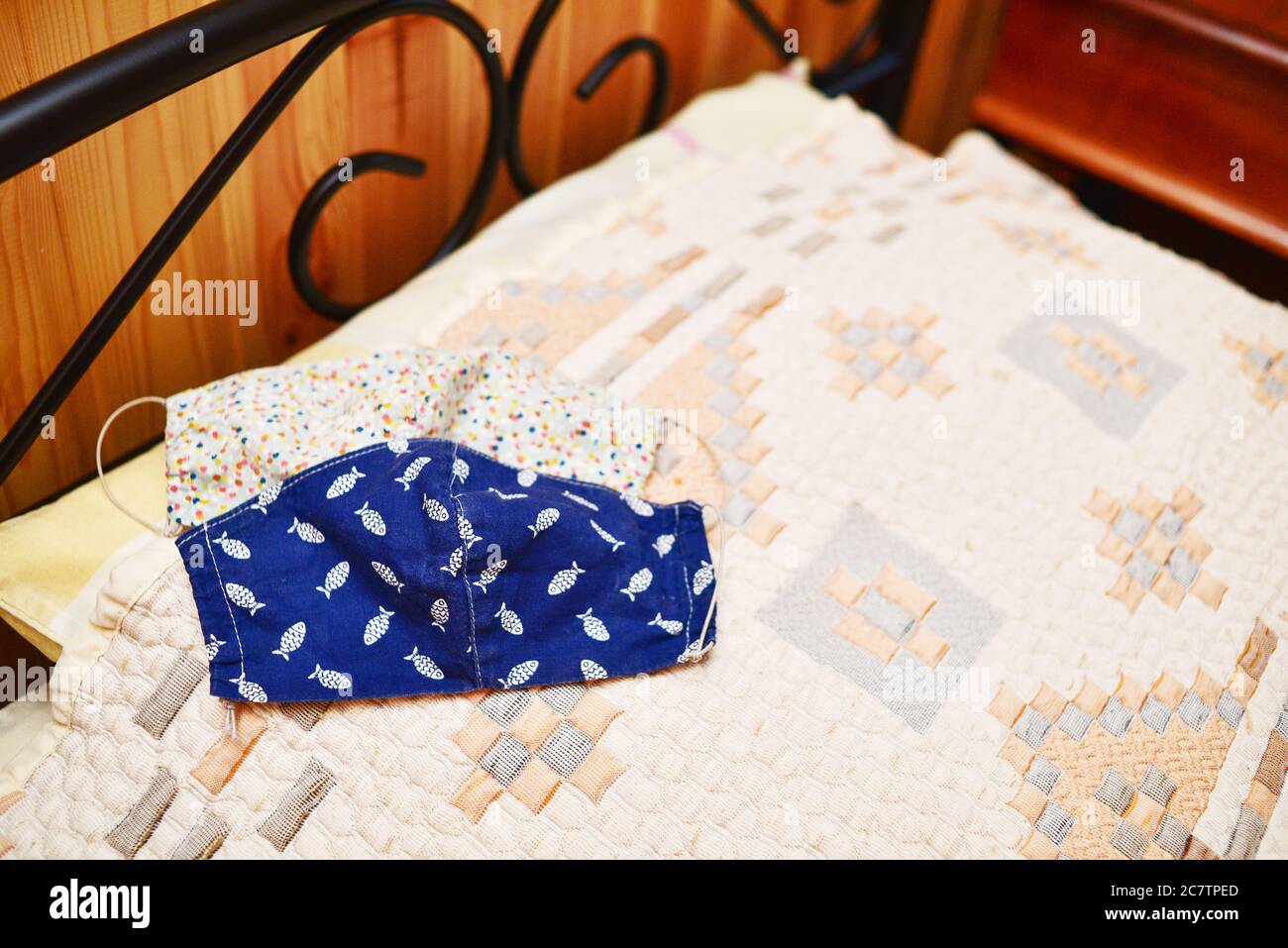 Protective mask near the bed. Protective mask in the bedroom. Infection ...