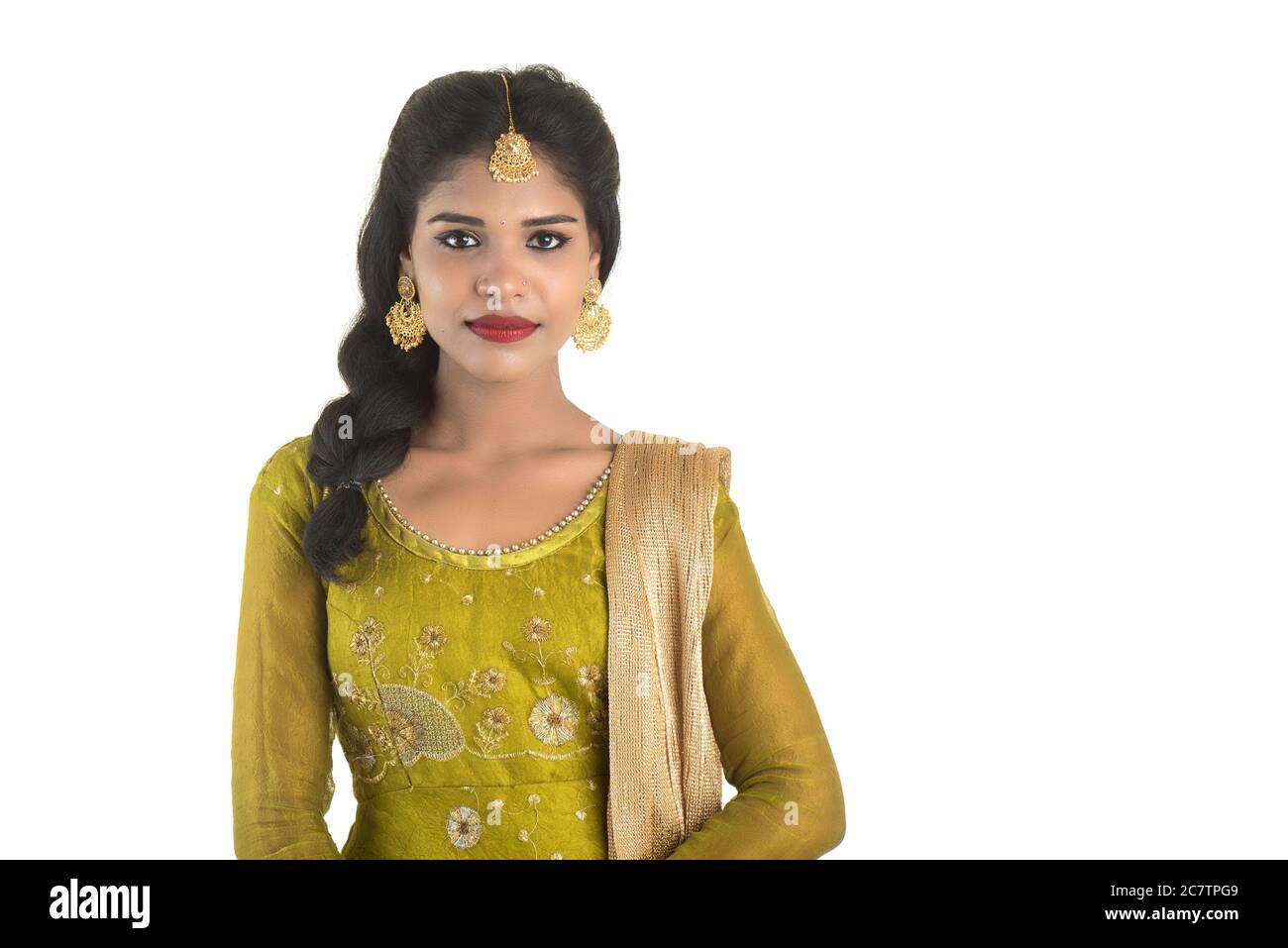 Portrait of beautiful traditional Indian girl posing on white ...