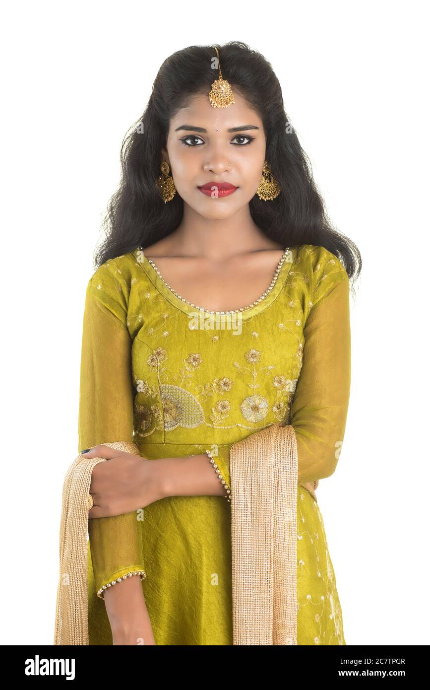 Portrait of beautiful traditional Indian girl posing on white ...