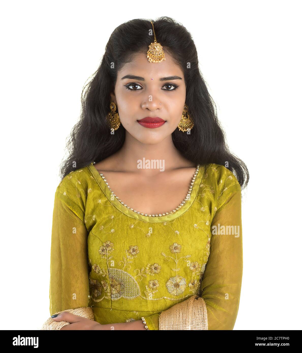 Portrait of beautiful traditional Indian girl posing on white ...