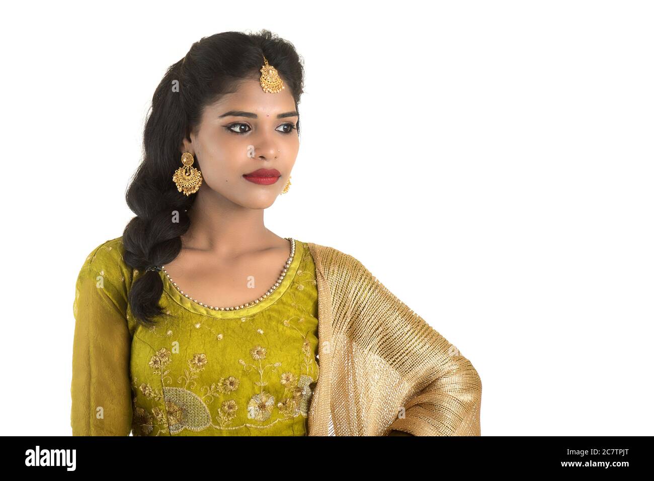 Portrait of beautiful traditional Indian girl posing on white ...