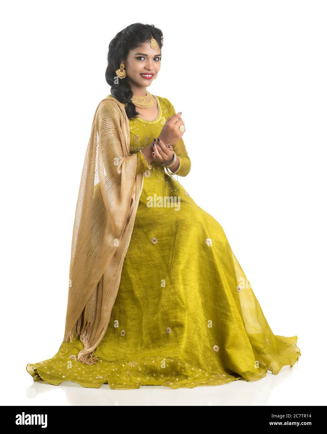 Portrait of beautiful traditional Indian girl posing on white ...