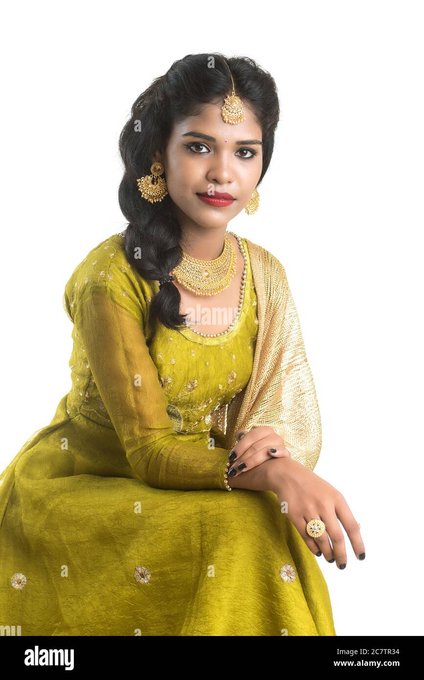 Portrait of beautiful traditional Indian girl posing on white ...
