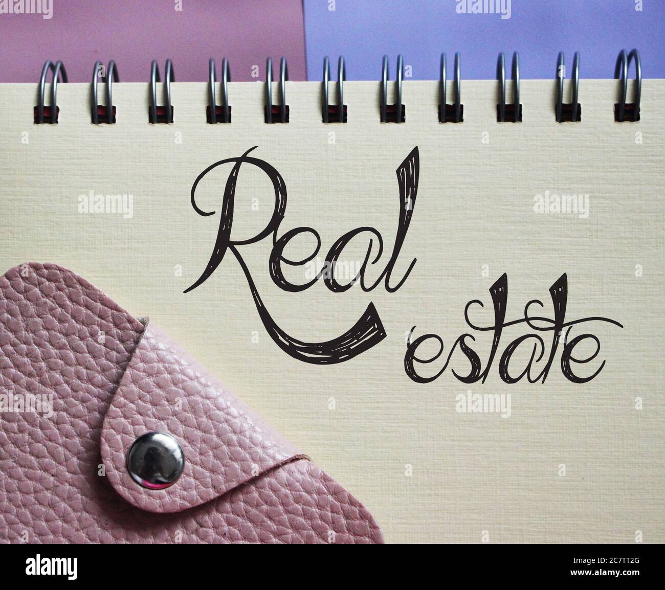 Real estate concept. Notepad with wallet and Real Estate words message ...