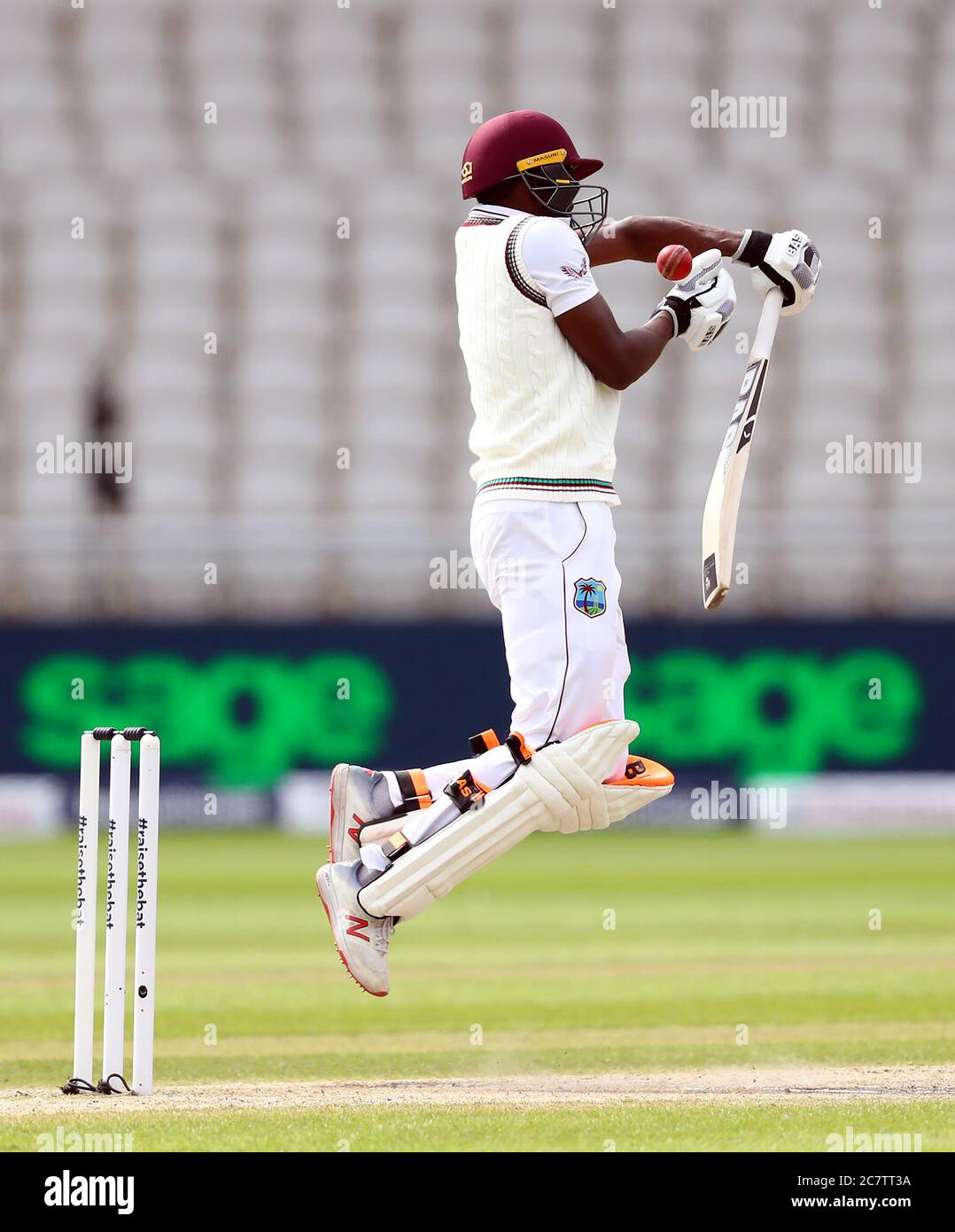 West Indies’ Shamarh Brooks fends off a bounder from England’s Stuart ...