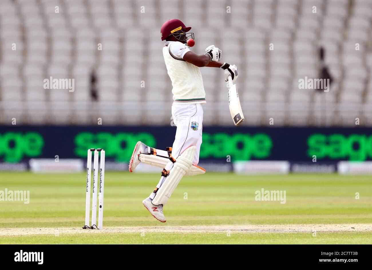 West Indies’ Shamarh Brooks fends off a bounder from England’s Stuart ...