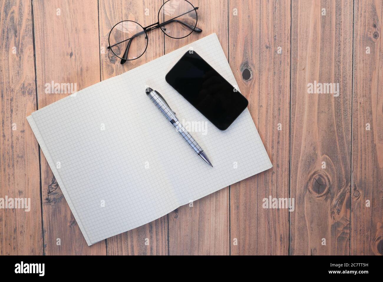 smart phone with empty screen an open notepad Stock Photo - Alamy