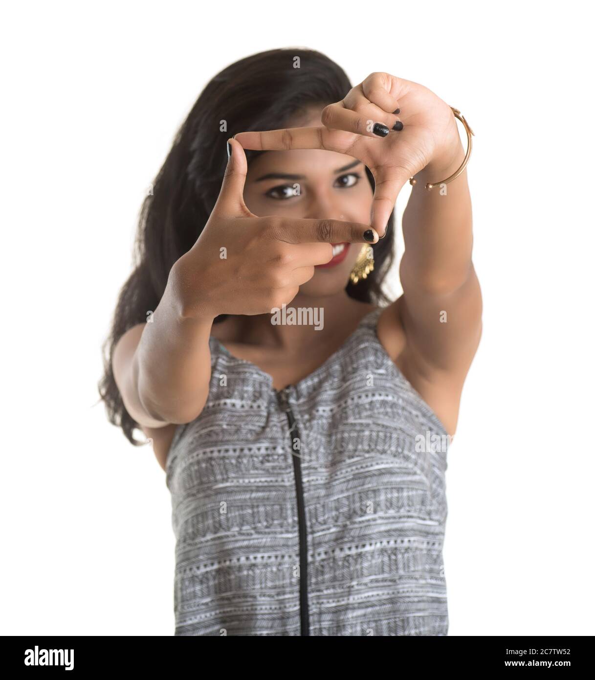 Smiling cheerful girl showing sign isolated on white background Stock ...